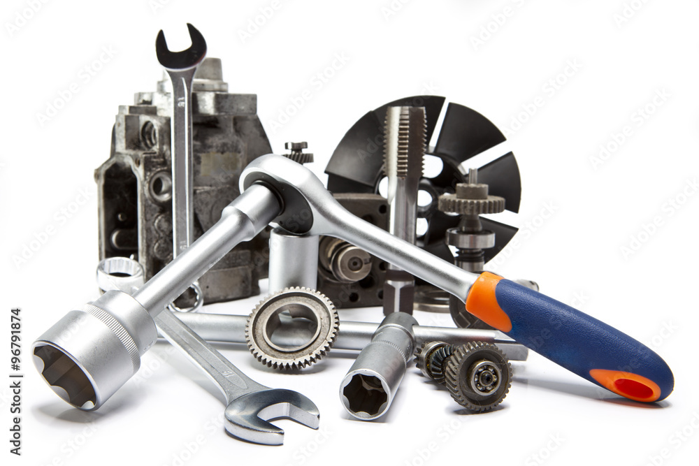 the part of car high pressure pump and the tool for repair on white ...