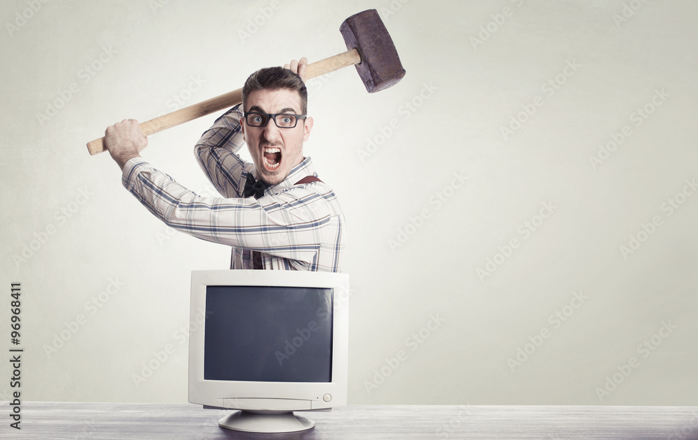 young angry nerd destroying old computer monitor Stock Photo | Adobe Stock
