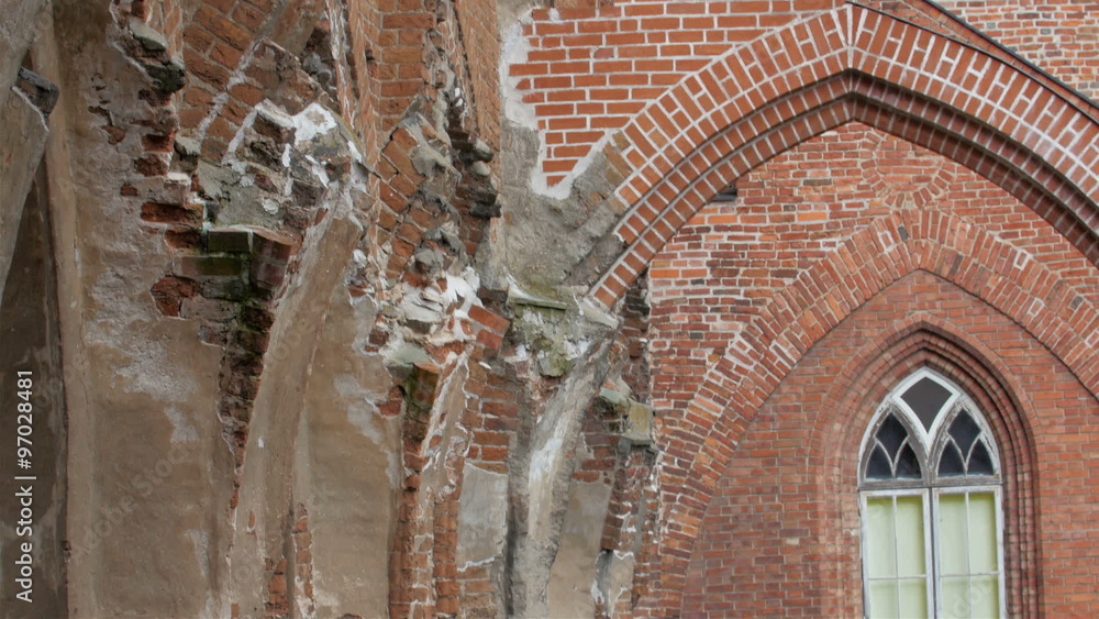 The old ruined bricked wall church. Some parts of the church are ...