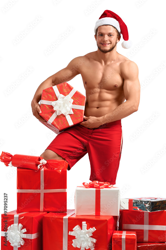 Let me choose for you. Young Santa with astonishing ripped body posing ...