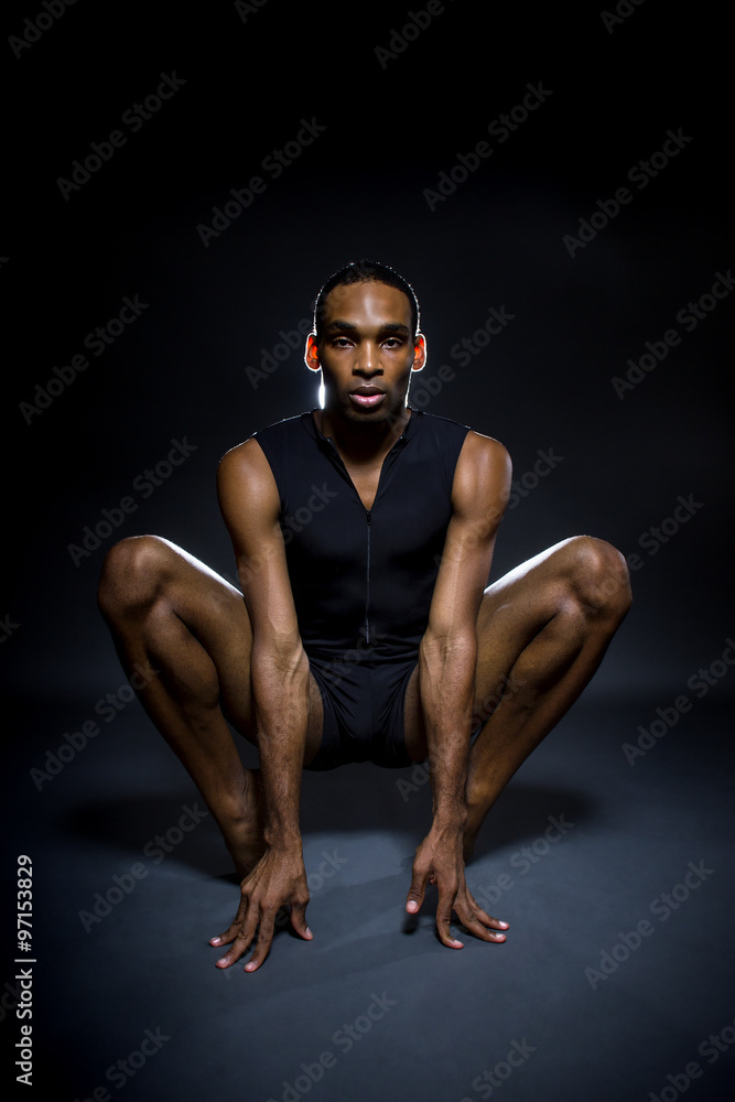 Black male dancer practicing warm up exercises for flexibility Stock ...