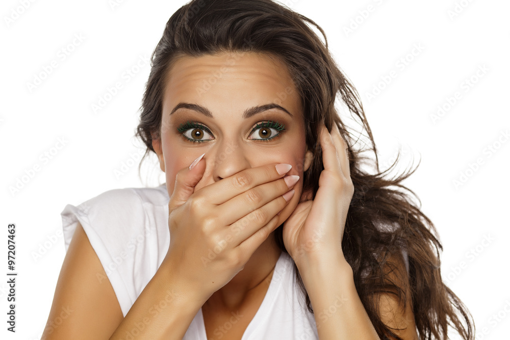 pretty embarrassed young woman covering her mouth with her hand Photos ...