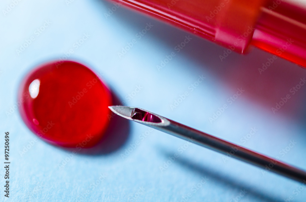 Extracted blood in syringe with hypodermic needle, blood drops. Stock ...