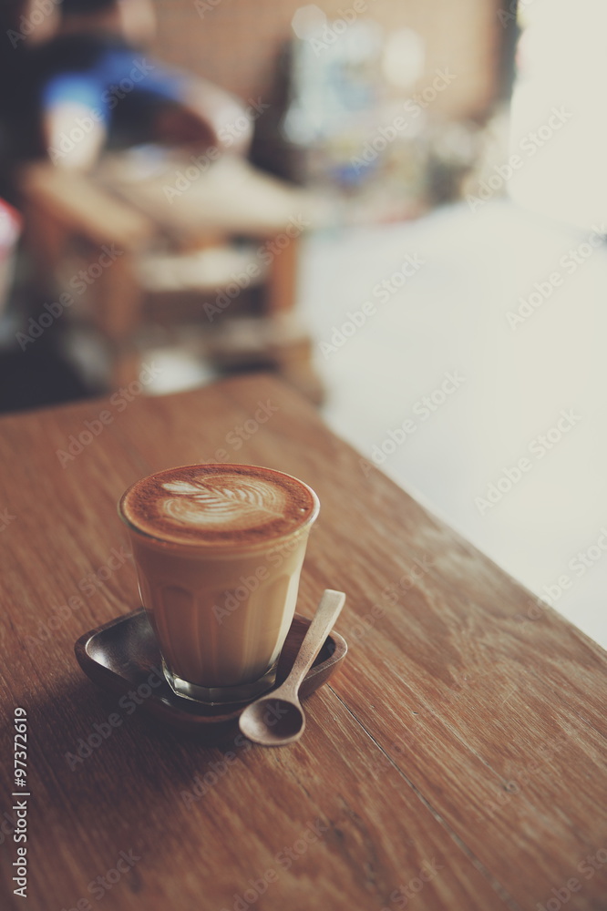 cup of coffee latte on the wood texture in vintage color tone Stock ...