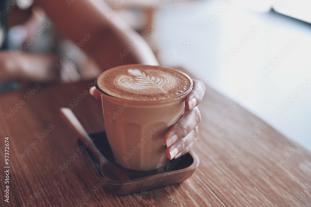 cup of coffee latte on the wood texture in vintage color tone Stock ...