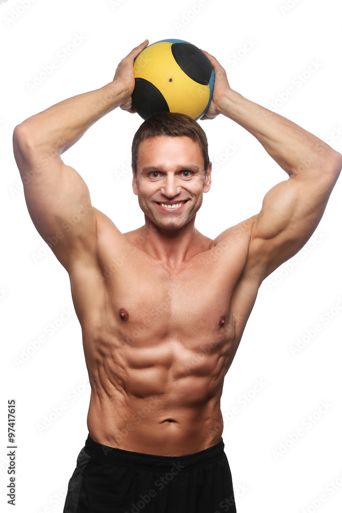 Smiling shirtless bodybuilder posing with valleyball. Stock Photo ...