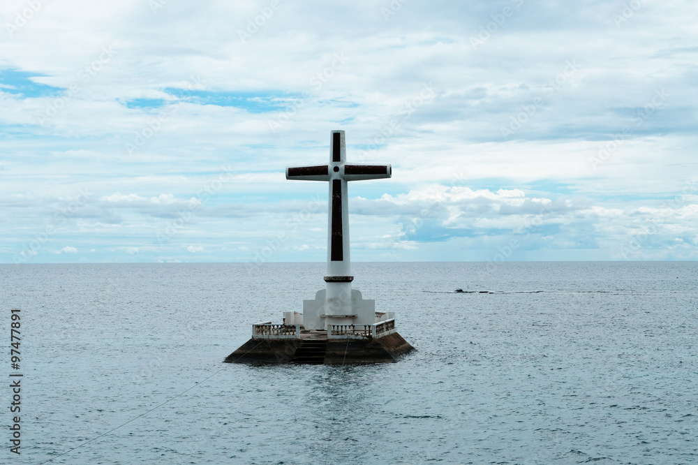 Camiguin Island, Philippines - A huge cross floating on a pontoon marks ...