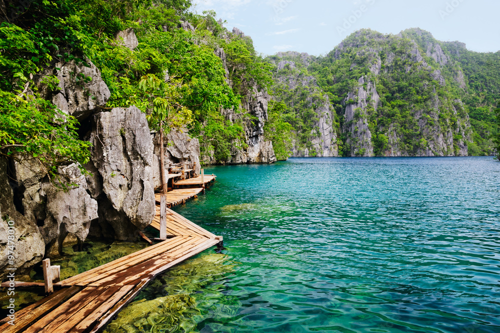 Kayangan lake on Coron Island, surrounded by limestone cliffs, is a ...