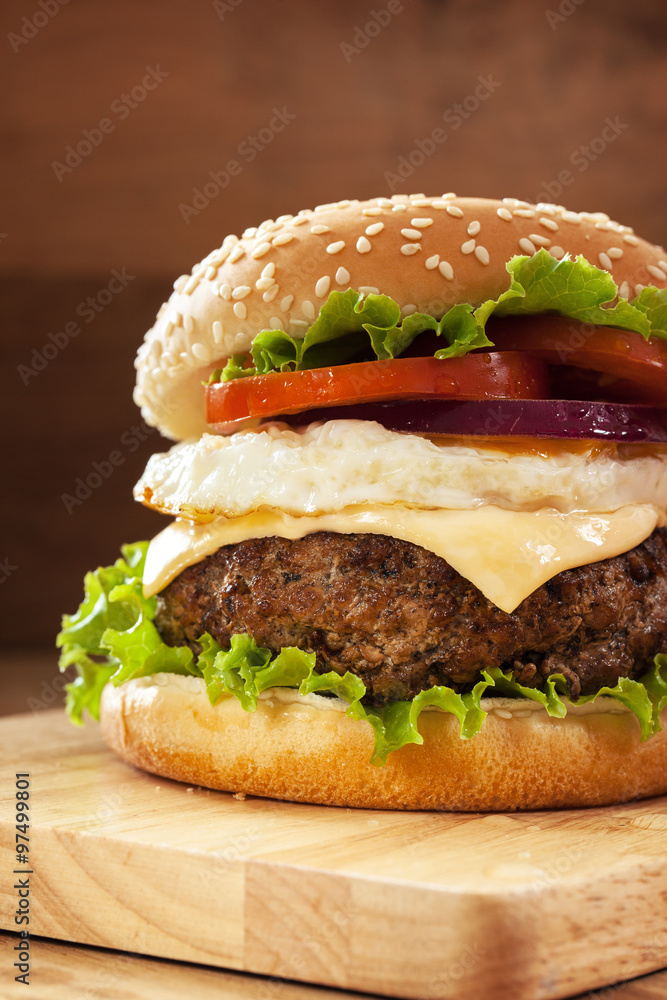 hambuger with pork grilled,egg fried and vegetable on wooden boa Stock ...