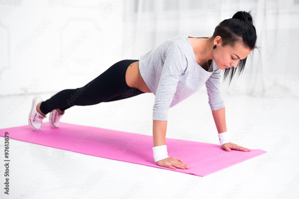 teenage girl doing push ups warming up working at home fitness, sport ...