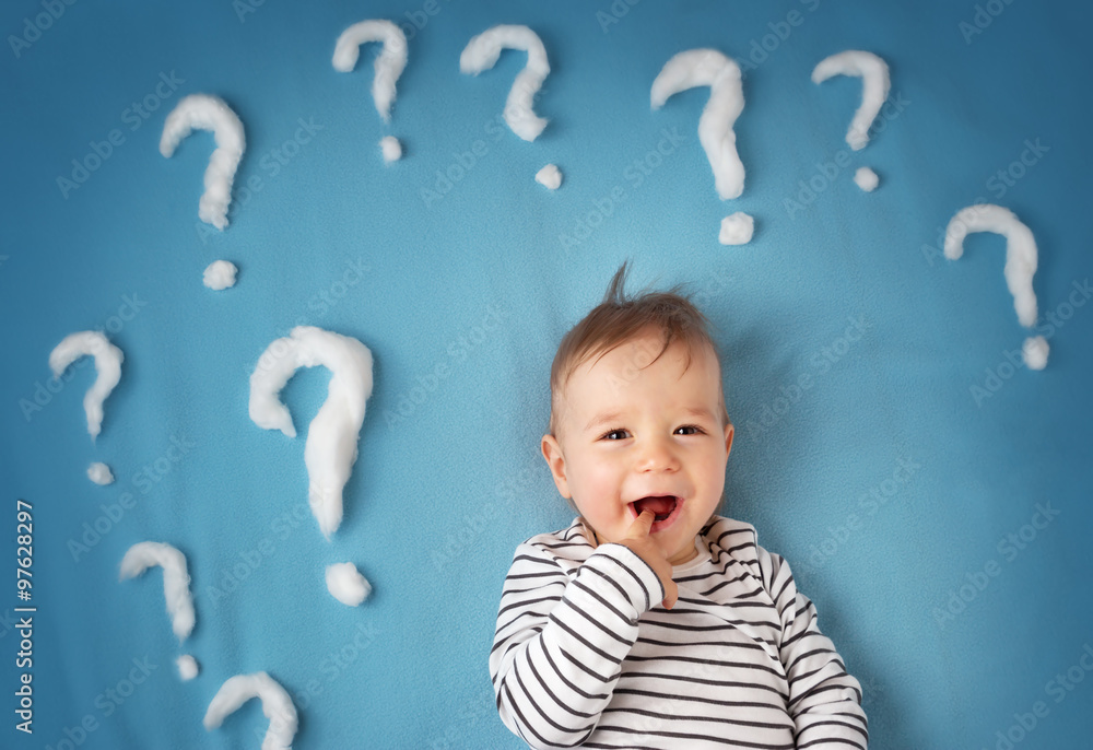 little boy with lots of question marks Stock Photo | Adobe Stock
