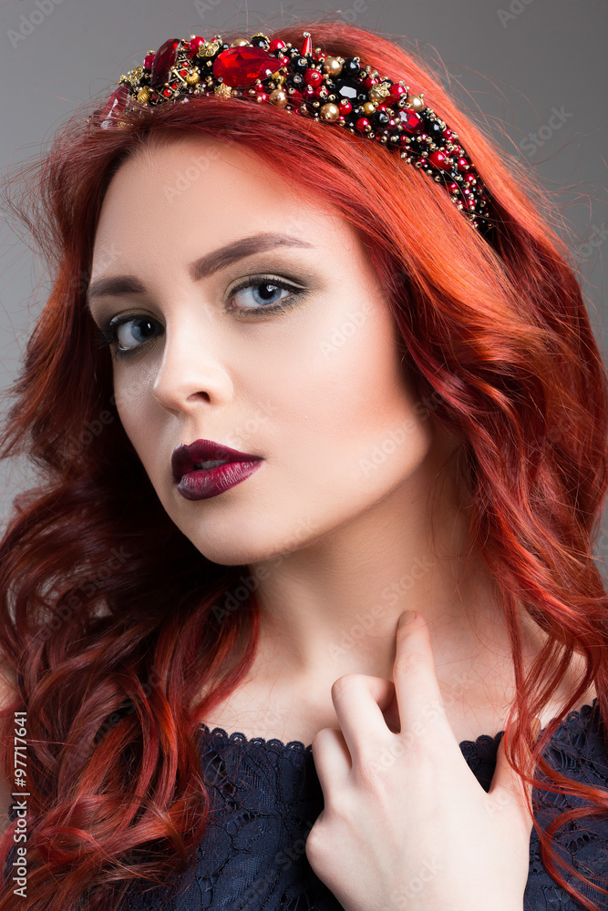 Beautiful red-haired fashion model posing in evening dress and in the ...