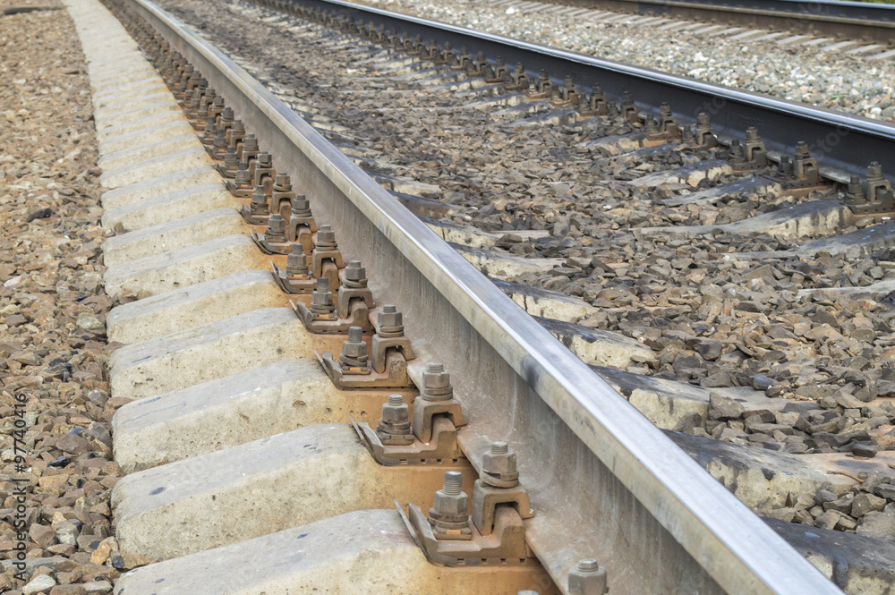 Steel railway rails, concrete cross ties, gravel Stock Photo | Adobe Stock