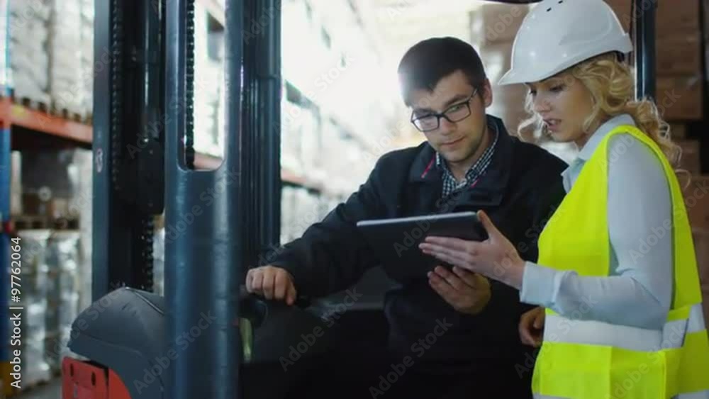 Logistic Warehouse Female Manager and Forklift Loader Operator have ...