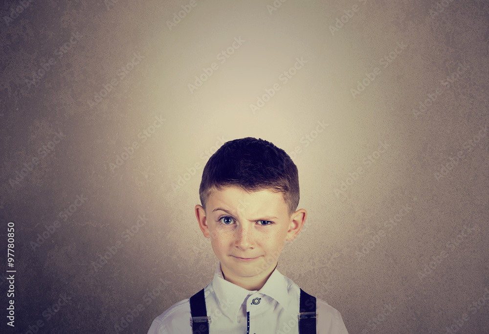 Funny emotion of little boy young man with a raised eyebrow wearing ...