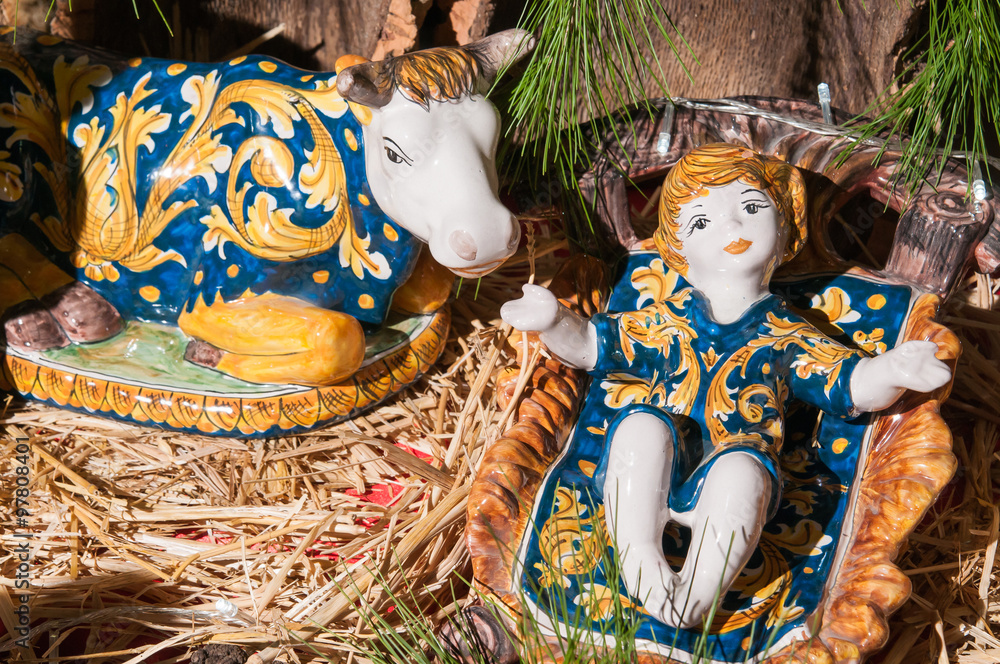 Painted pottery statue portraying baby Jesus in the ceramic nativity ...