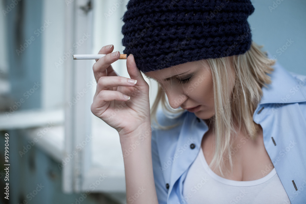 Frustrated blond female druggie has unhealthy lifestyle Stock Photo ...