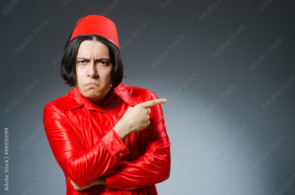 Man wearing red fez hat Stock Photo | Adobe Stock