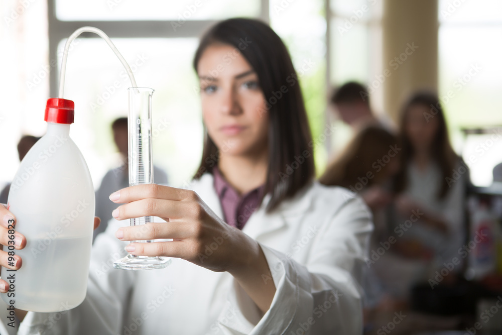 Scientific researcher holding a distilled purified deionised water in ...