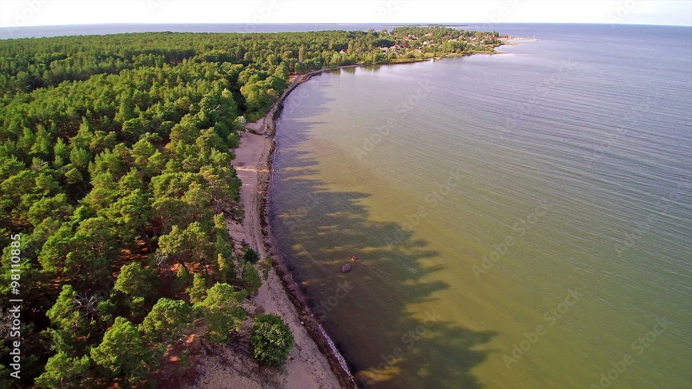 Beautiful sea of Kaberneeme in Estonia. The seashore and the trees in ...