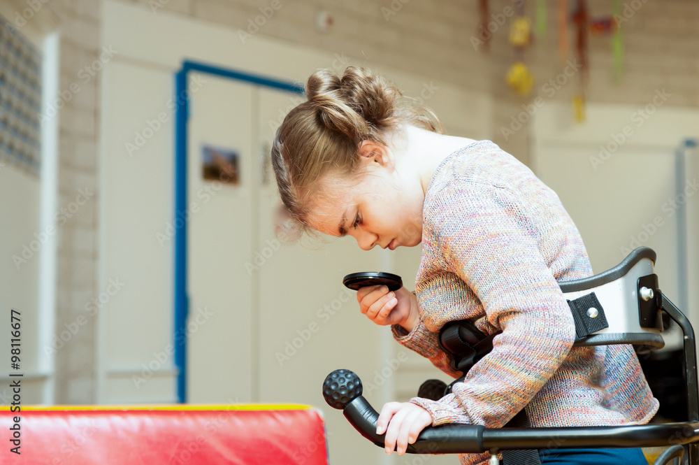 disability a disabled child exploring her environment / A disabled ...