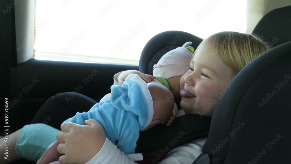 tender scene of blonde caucasian baby face two years old age sitting in ...