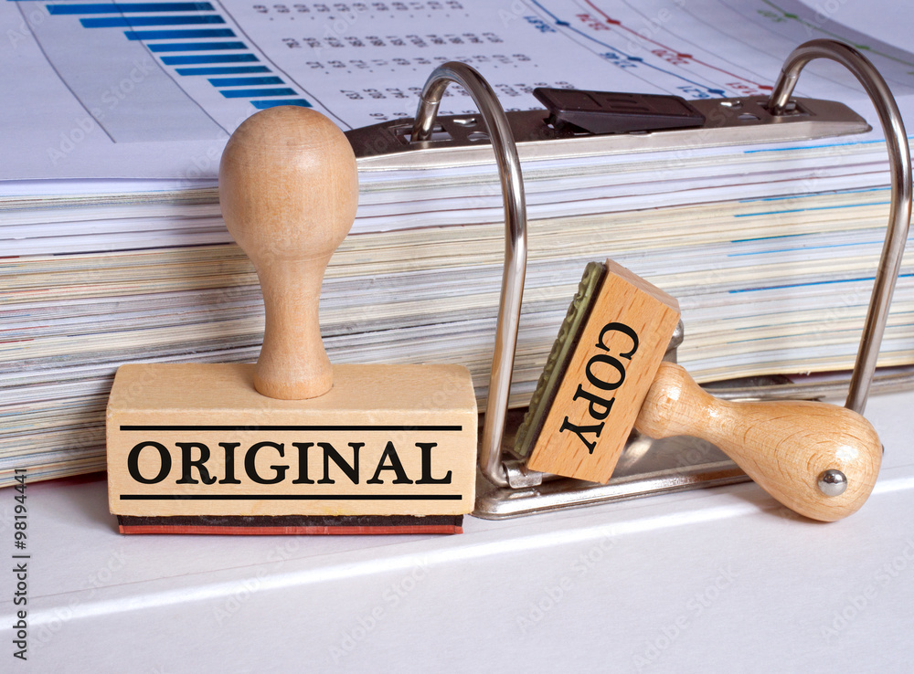 Original and Copy - two stamps with binder in the office Stock Photo ...