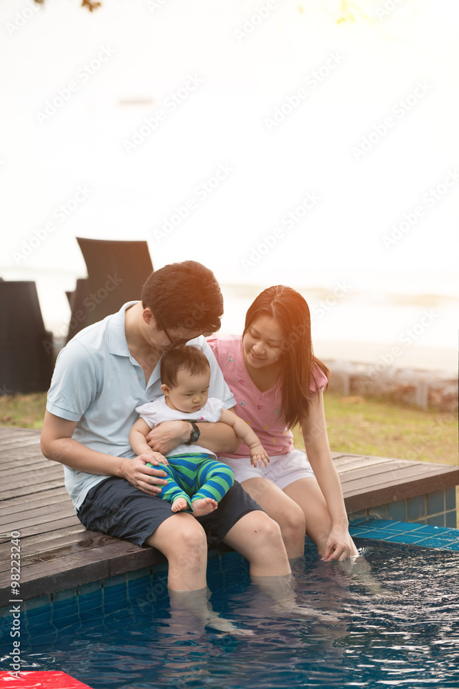 asian family having fun at the pool Stock Photo | Adobe Stock