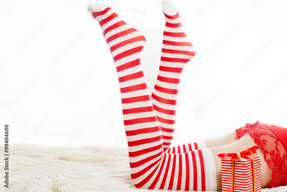 Sexy Santa woman legs with gift Stock Photo | Adobe Stock