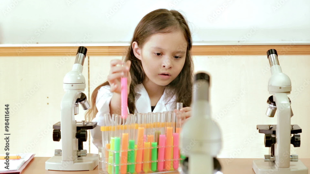 Child scientist doing experiments in science lab Stock Video | Adobe Stock
