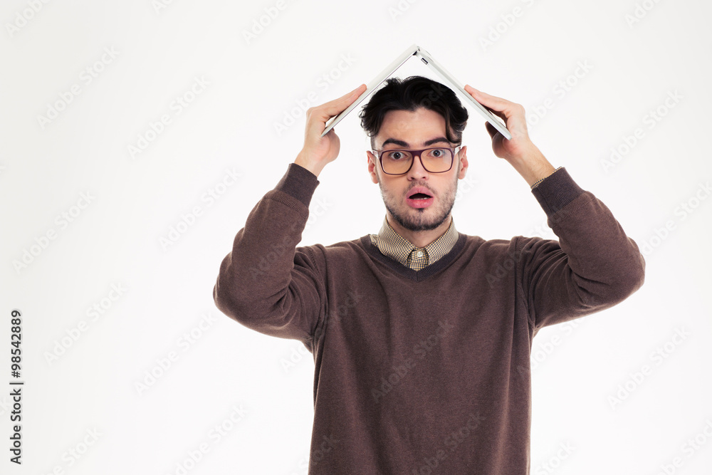 Shocked man holding laptop computer over head Stock Photo | Adobe Stock