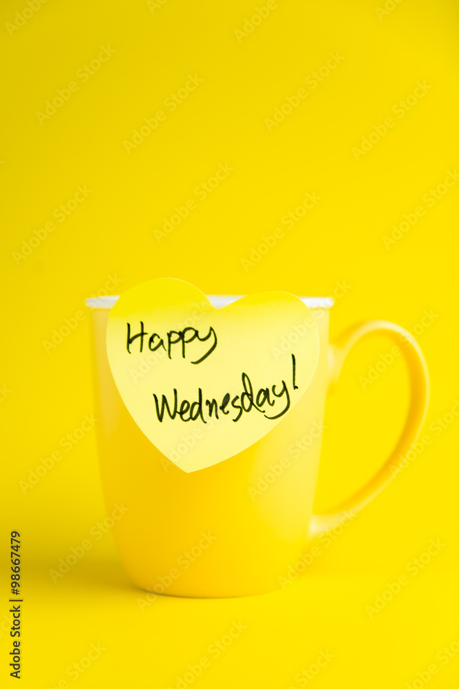 Happy Wednesday message on yellow mug. Stock-Foto | Adobe Stock