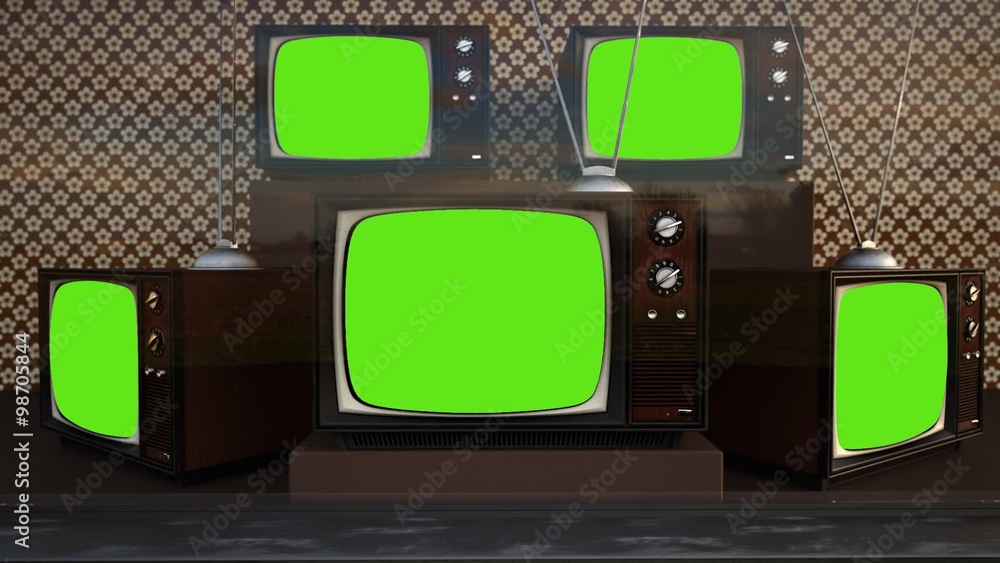 An exhibition of old-fashioned retro color tv sets with tuner antennas ...