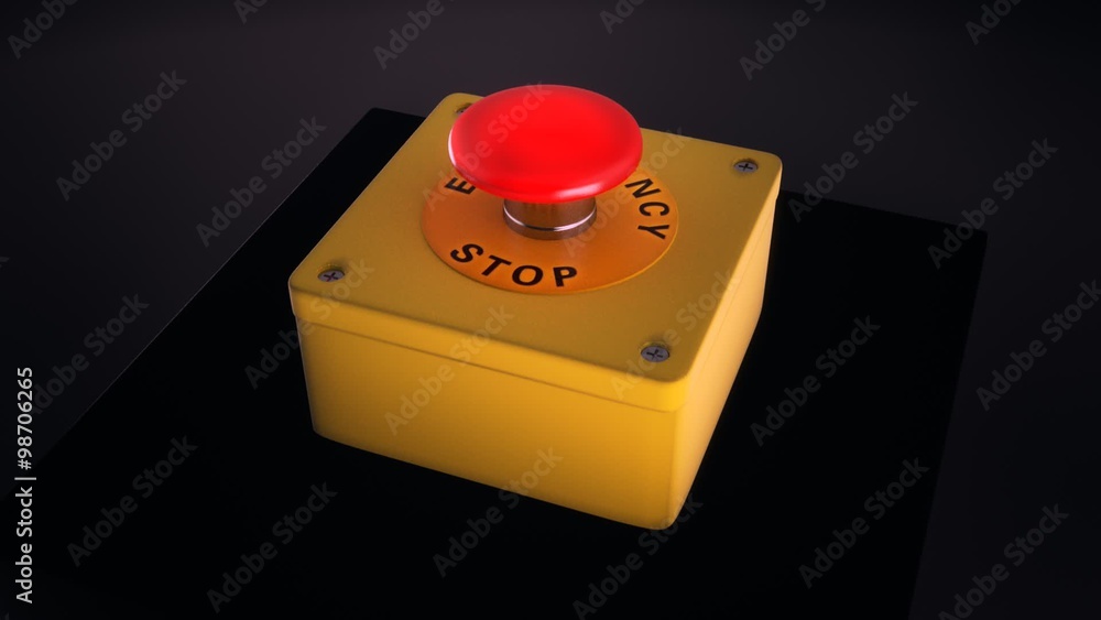 Red button with the 'Emergency stop' words on the panel. Red light is ...