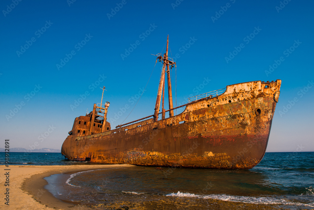 Old Ship. Ancient shipwrecks in the sea with sunset background ...