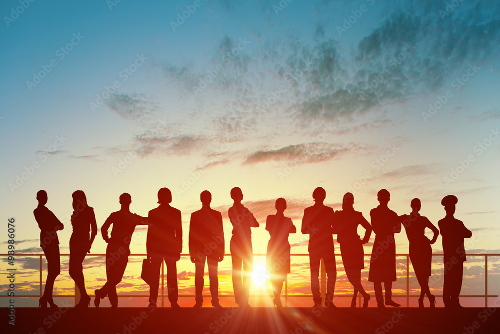 Teamwork on dawn background Stock Photo | Adobe Stock