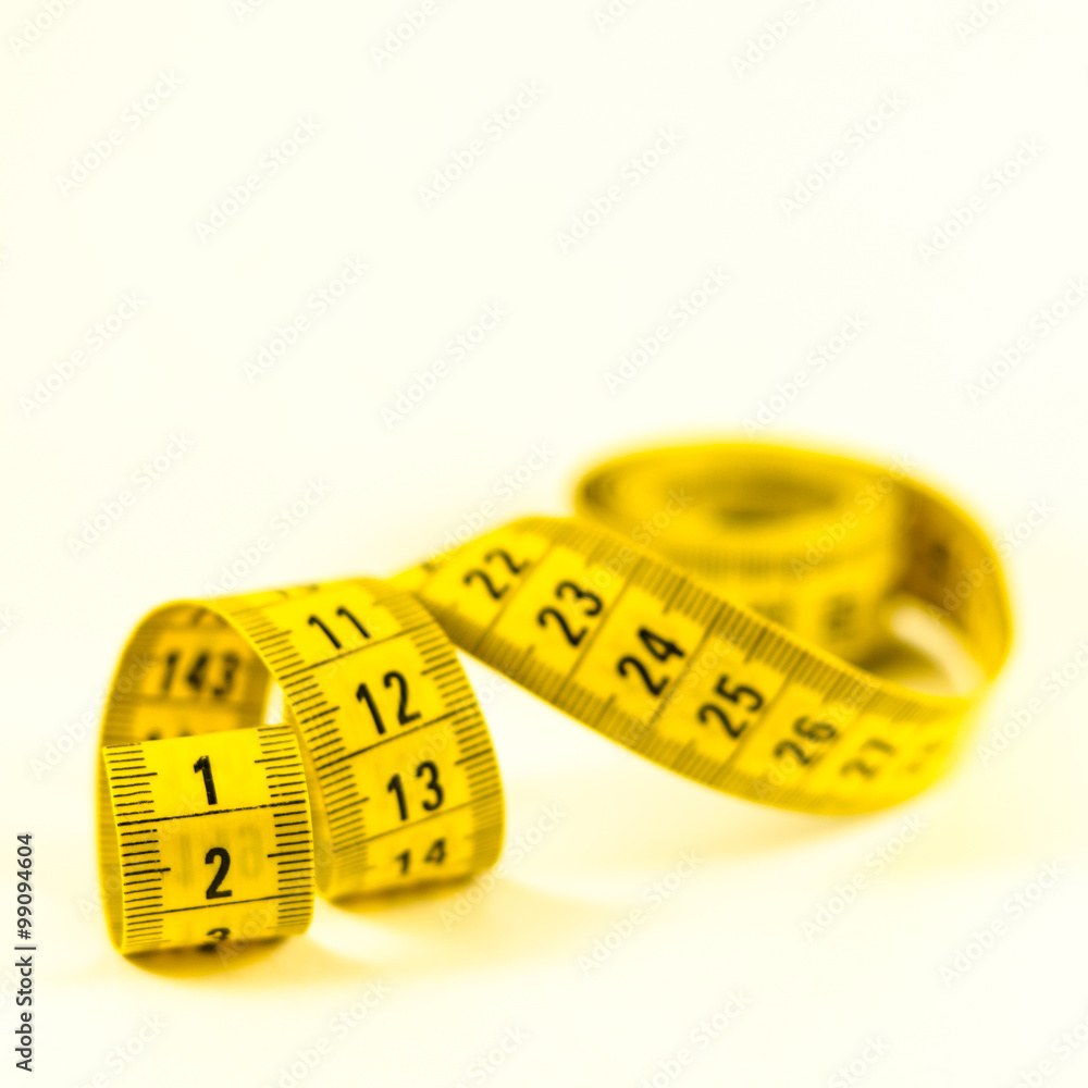 measure your goal, still life with a yellow tape measure , symbol of ...