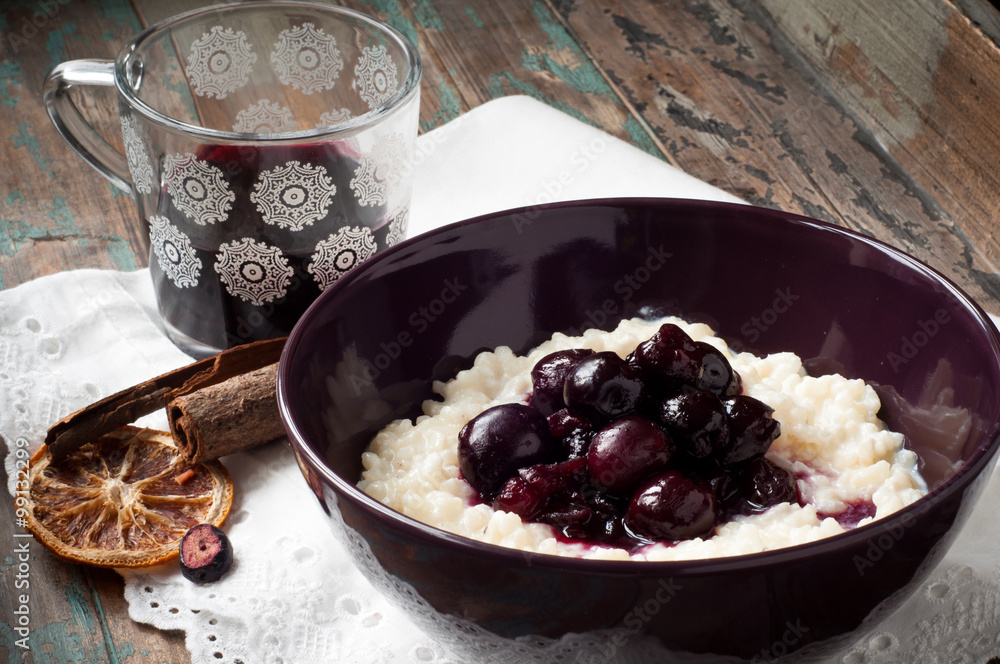 Traditional recipe Danish rice pudding topped with fresh blueberries ...
