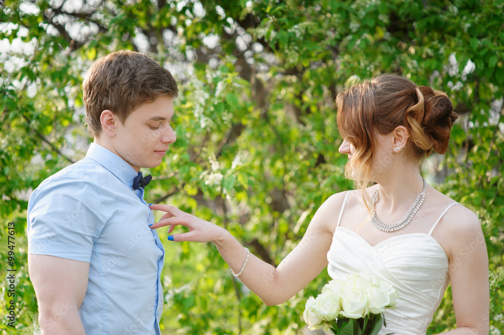 bride flirting with groom on a walk in spring garden foto de Stock ...