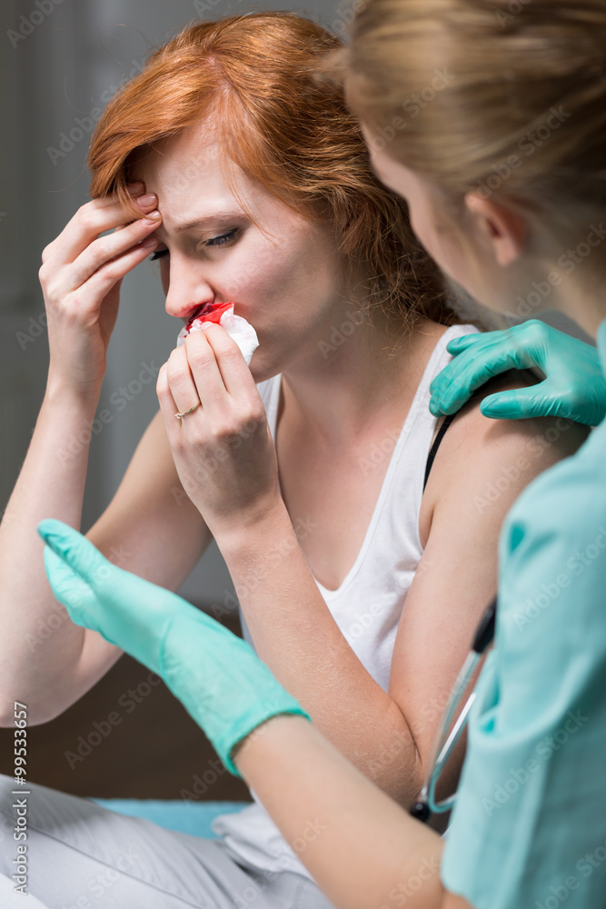 Female patient with bloody nose Stock Photo | Adobe Stock