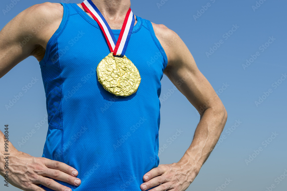 Athlete standing with gold medal hanging from a red white and blue ...