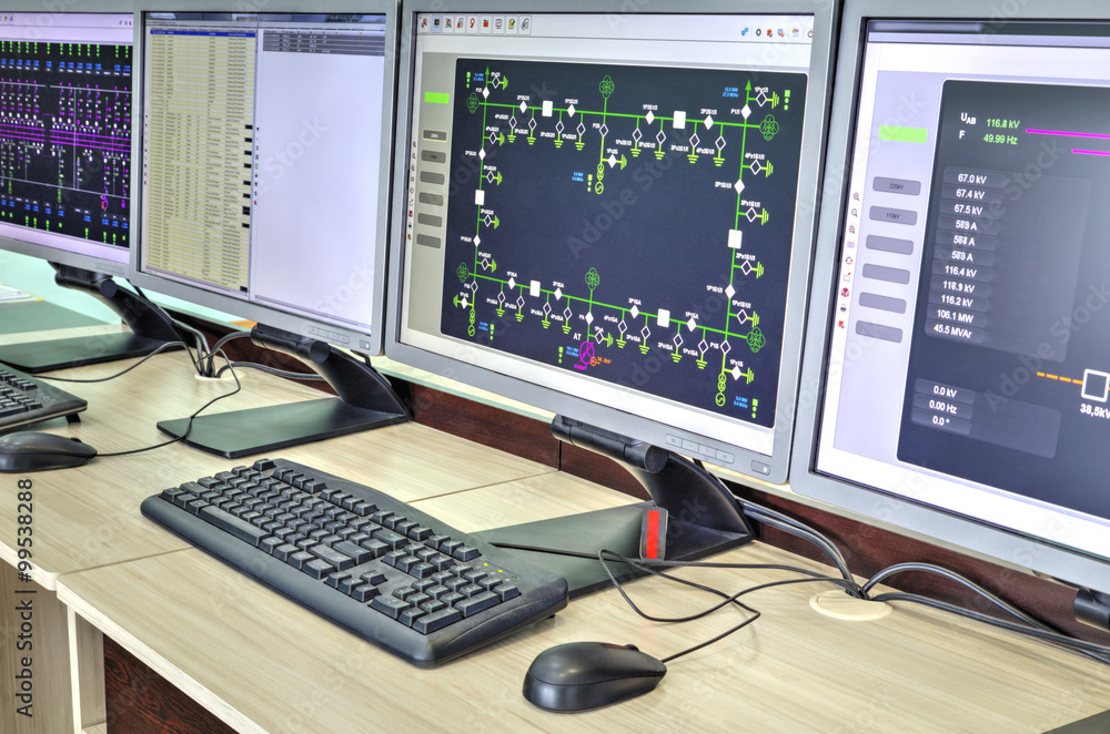 Computers and monitors with schematic diagram for supervisory, control ...