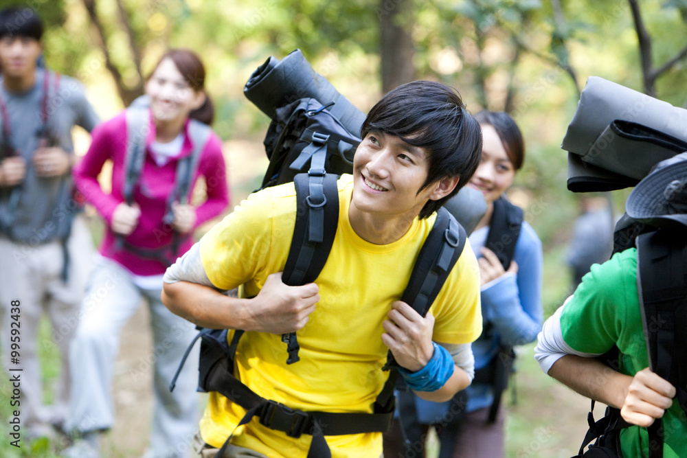 Young people go hiking in mountain Stock Photo | Adobe Stock