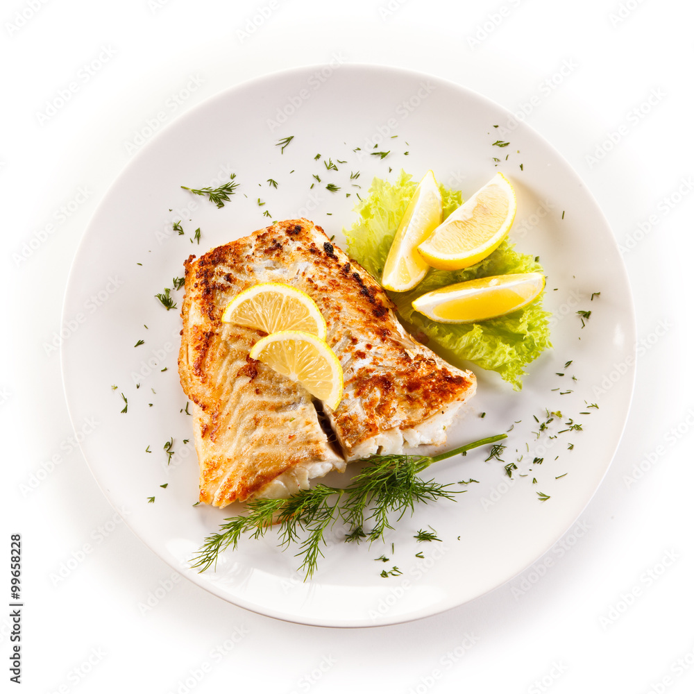 Fish dish - fried fish fillet and vegetables Stock Photo | Adobe Stock