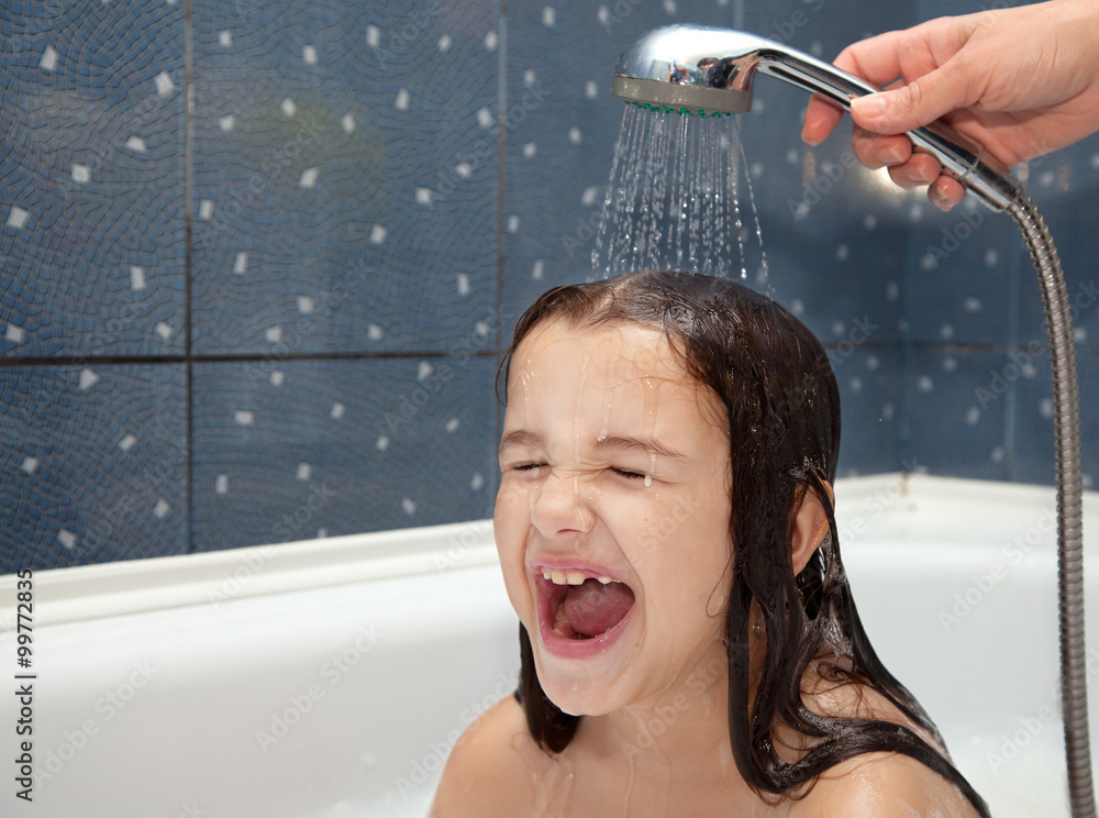 Mom Pours A Little Girl Out Of The Shower Stock Photo Adobe Stock