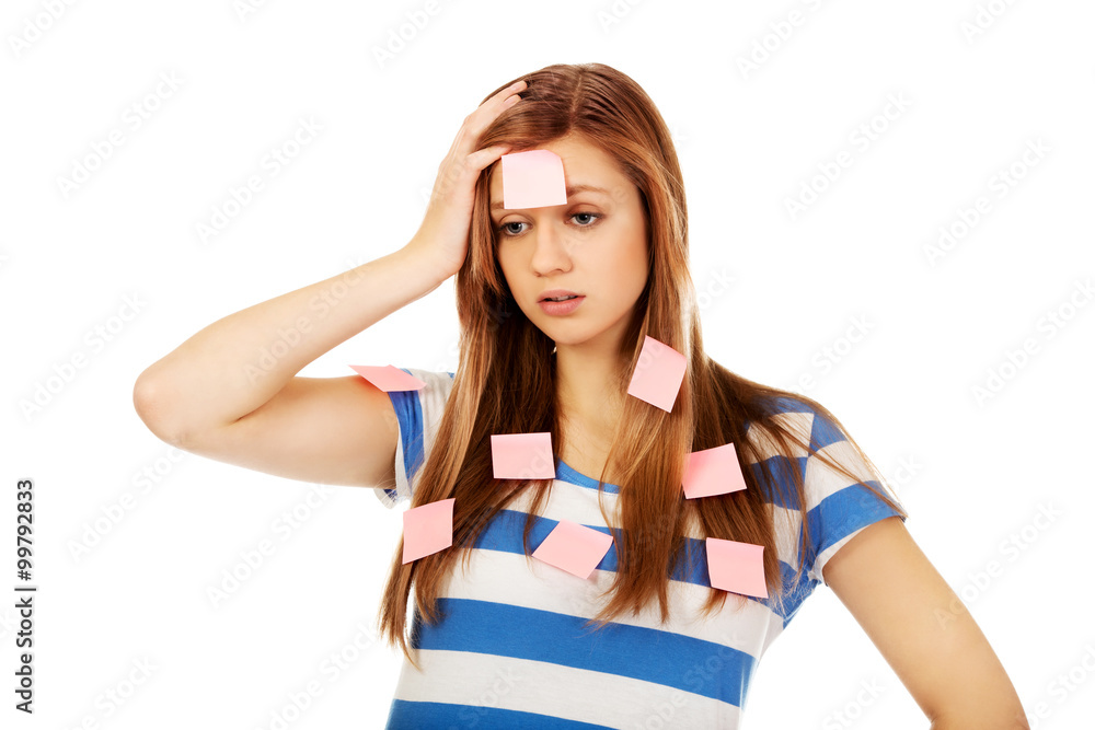 Teenage woman covered with post it notes Stock Photo | Adobe Stock