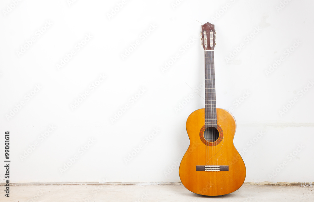 Old classical acoustic guitar on white wall background Stock Photo ...