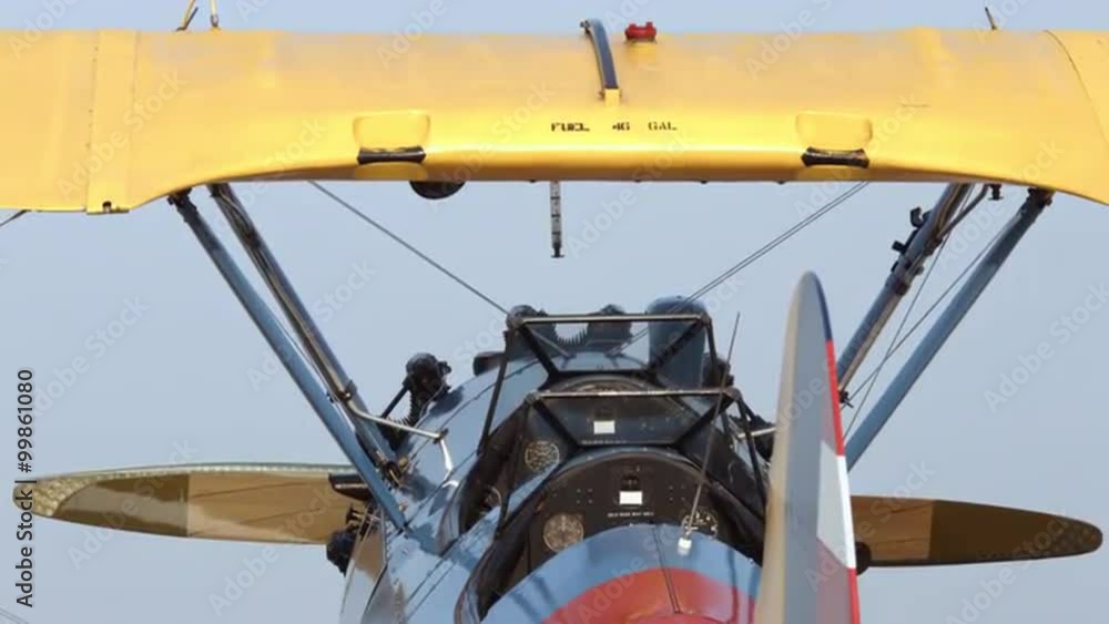 Tilt from sky down a view of upper wing and cockpit of a Boeing ...