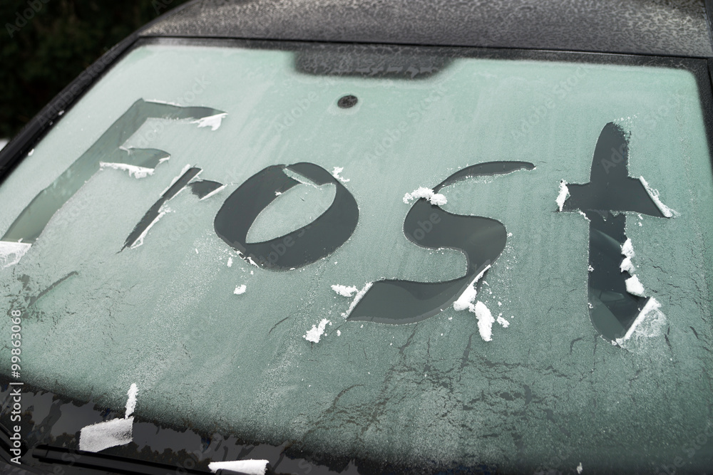 frozen windshield / frozen windshield of a car with the word frost ...