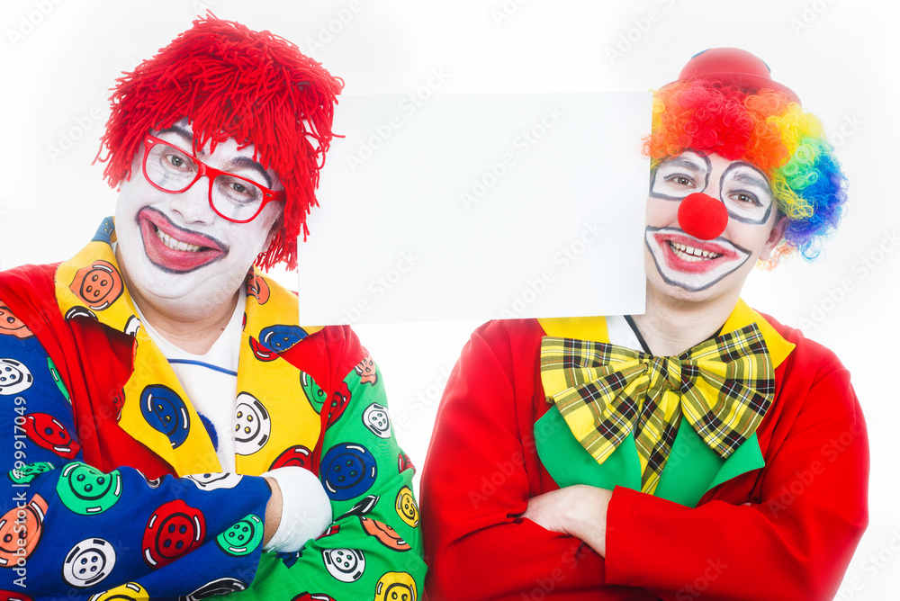 lustige clowns halten werbeschild mit dem kopf Stock Photo | Adobe Stock